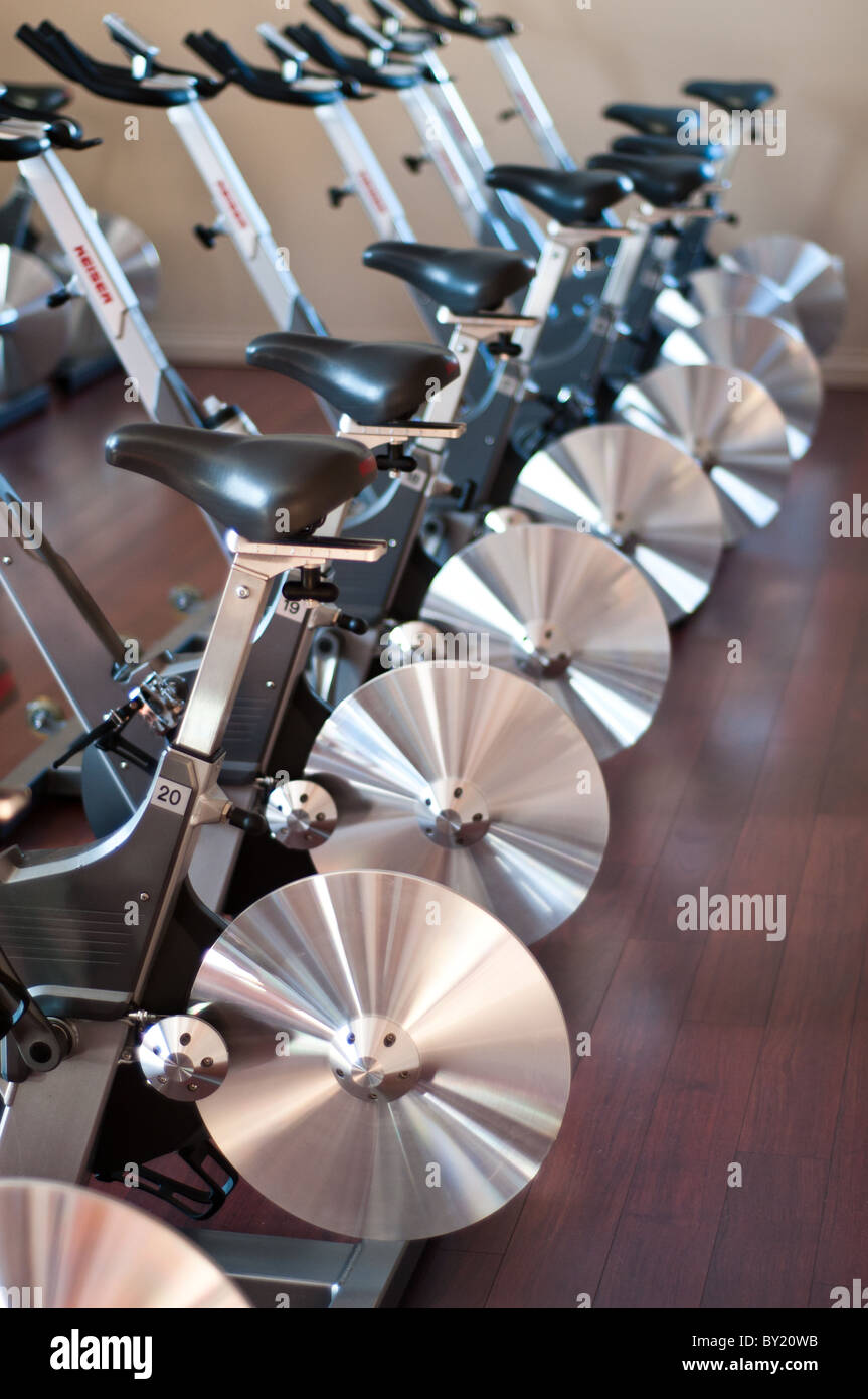Row of fitness bikes Stock Photo - Alamy