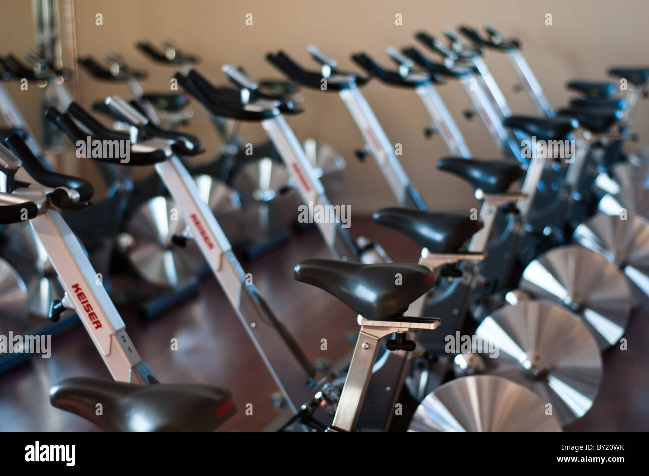 Row of fitness bikes Stock Photo - Alamy