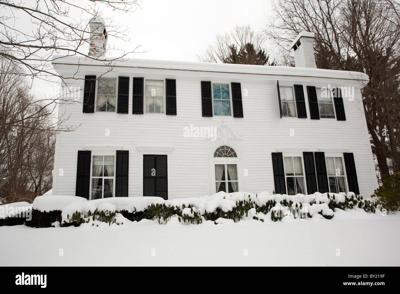 Snow is up to the window sills of a colonial home in Stockbridge ...