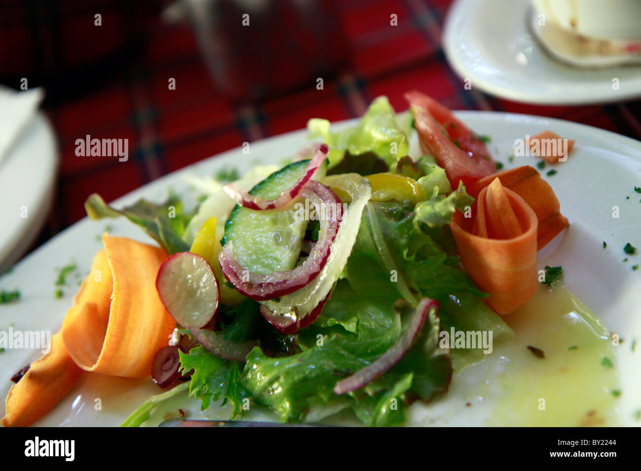 Side salad on plate of food in restaurant Stock Photo - Alamy