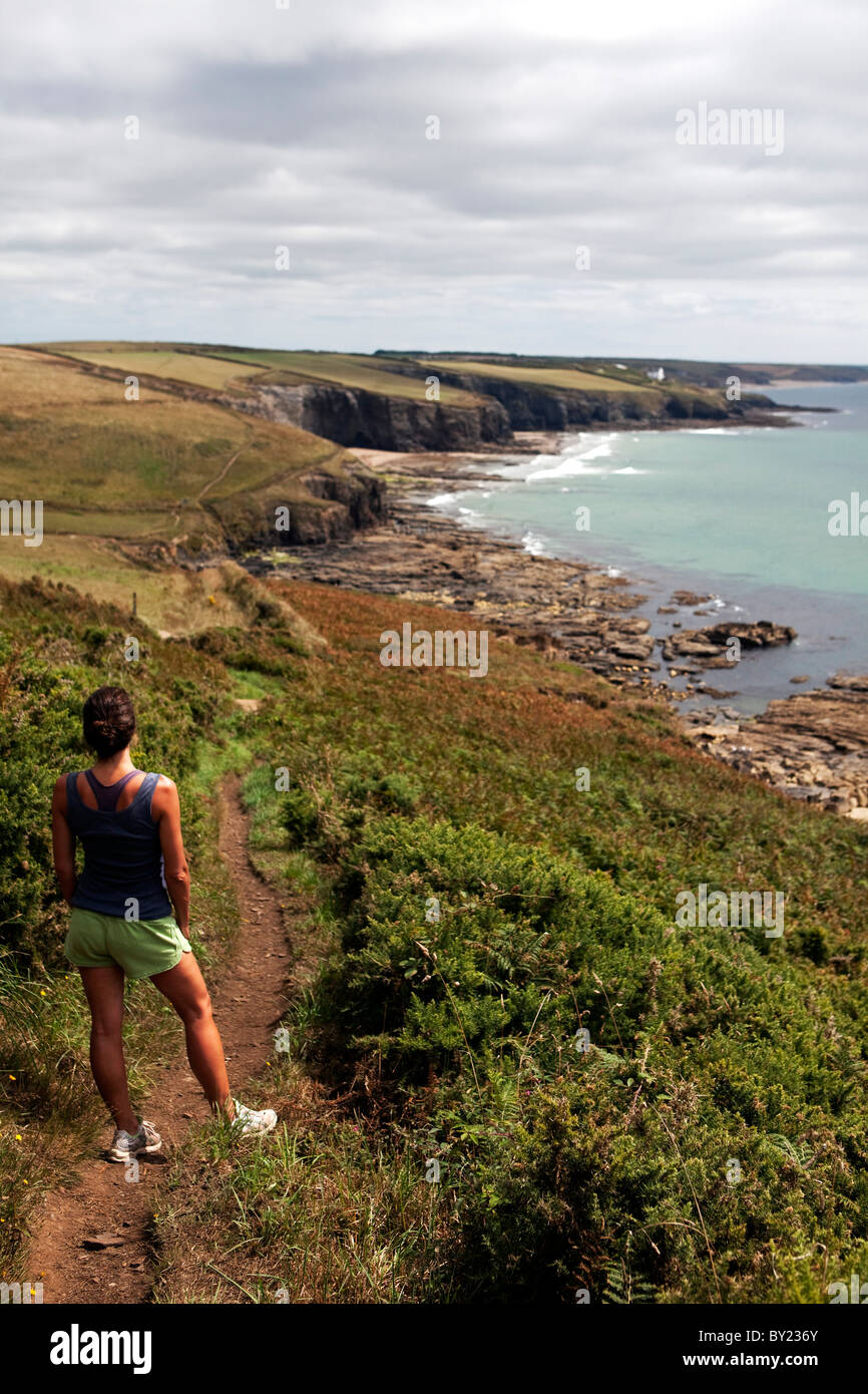 England, Cornwall. Walking along Cornwall's coastal footpath near ...
