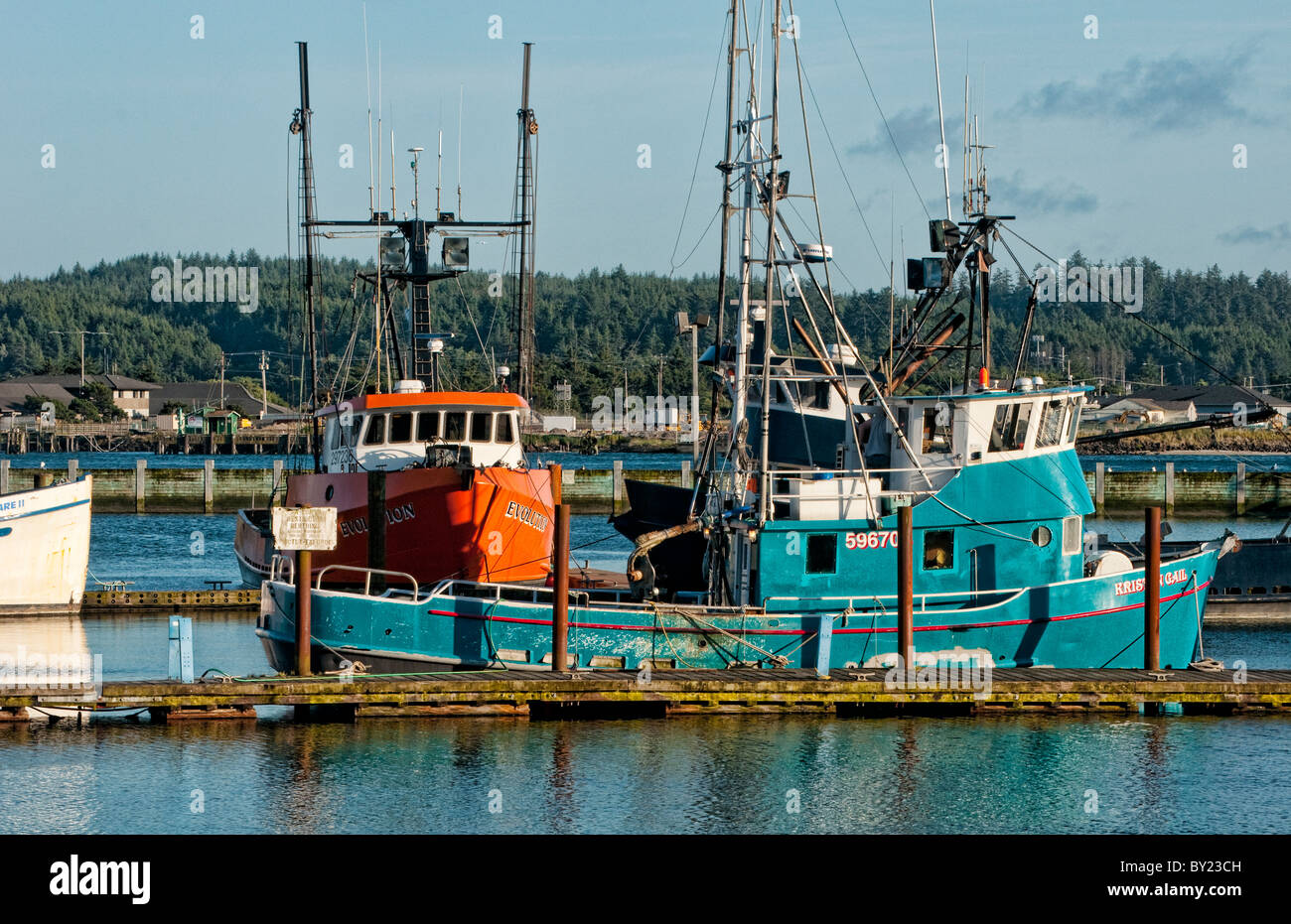 Beautiful old working fishing boats in harbor at sunset in Newport ...