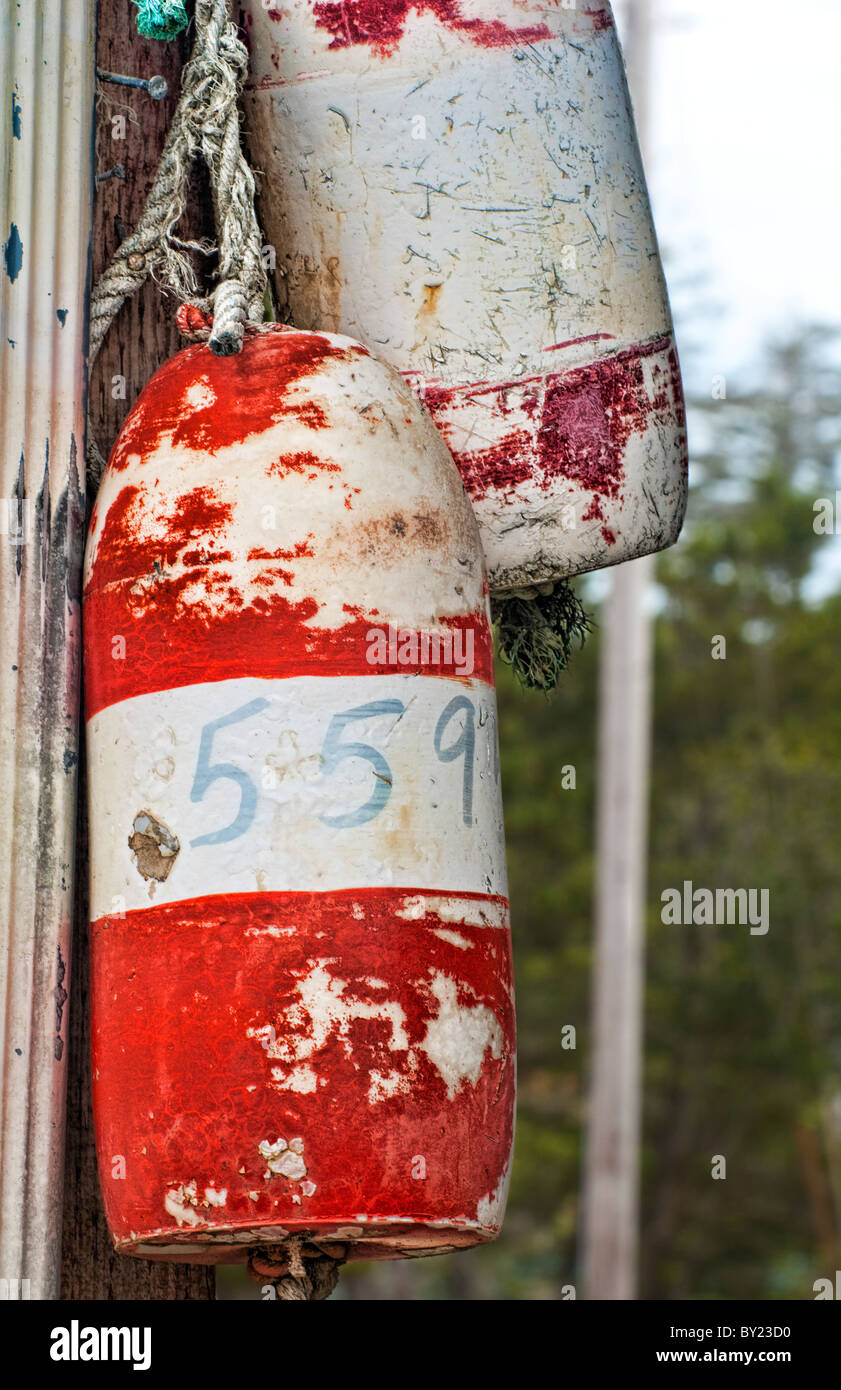 Old Buoys hanging with fish nets in Newport Oregon on the Oregon Coast ...