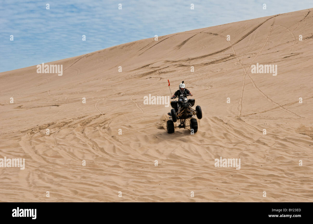 Teens riding all the massive sand dunes in Oregon Dunes National ...