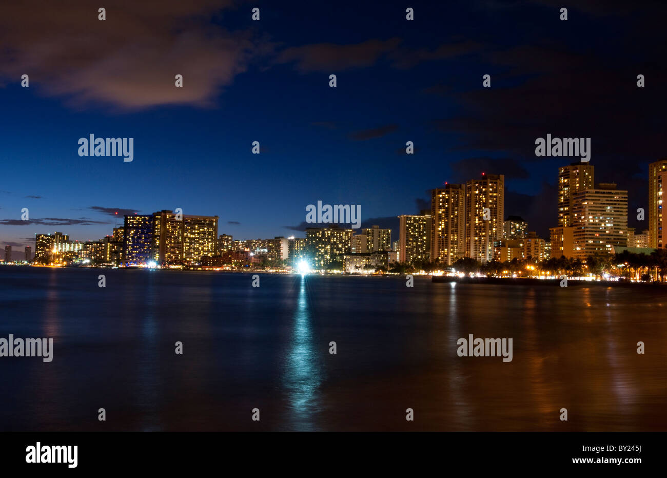 Hawaii Honolulu twilight of Waikiki Beach at night with colorful sky in ...