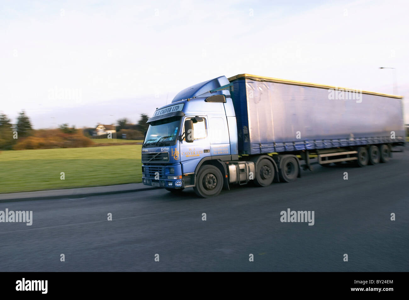 Articulated truck on the road Stock Photo - Alamy