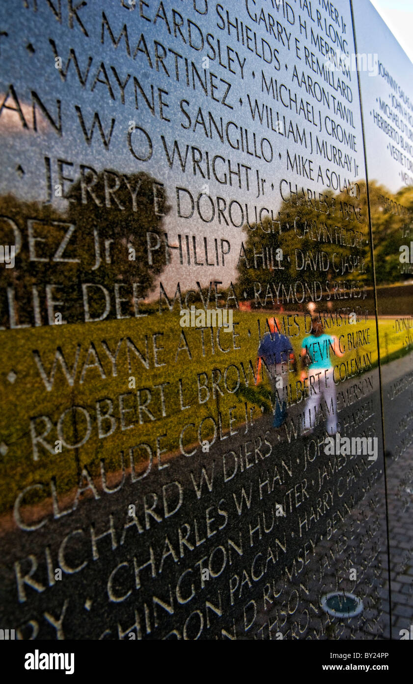 Reflections of hero names of war dead at Vietnam Veterans Memorial Wall ...