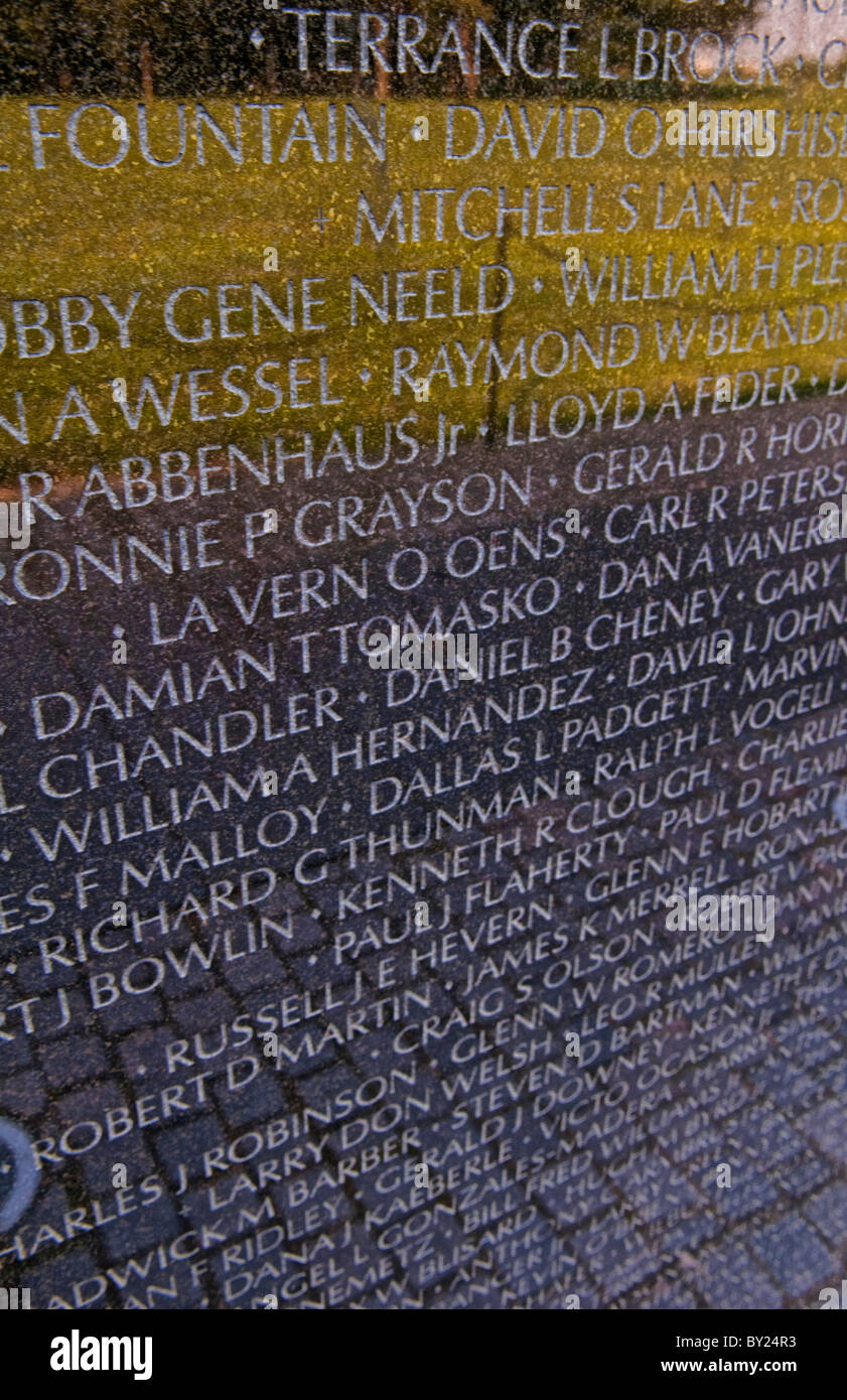 Reflections of hero names of war dead at Vietnam Veterans Memorial Wall ...