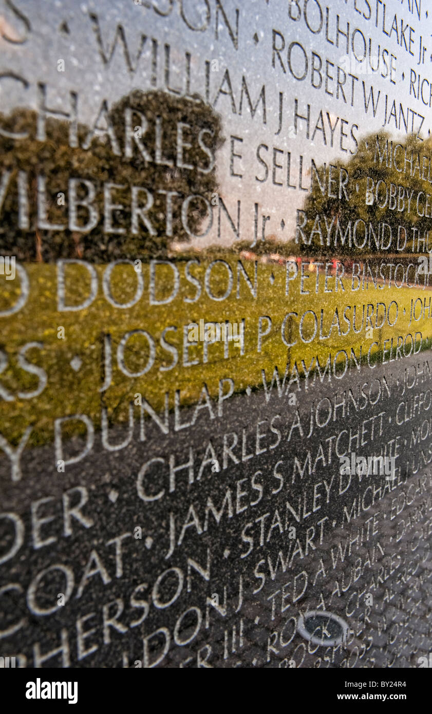 Reflections of hero names of war dead at Vietnam Veterans Memorial Wall ...