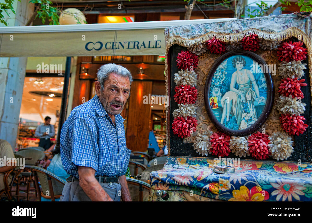 Old man playing instrument called Laterna in Plaka in downtown Athens ...