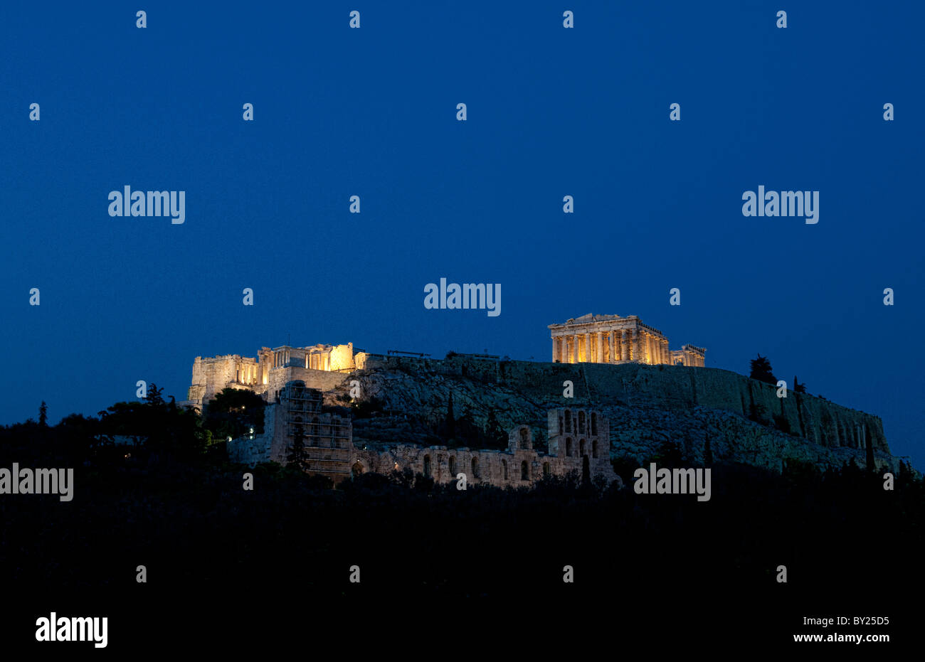 Scenic twilight night view of Acropolis Parthenon hill downtown Athens Greece looking up at ...