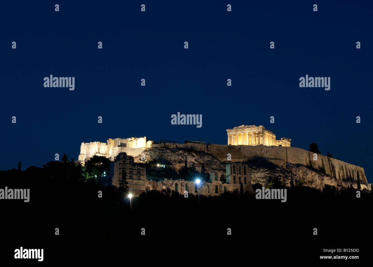 Scenic twilight night view of Acropolis Parthenon hill downtown Athens Greece looking up at ...
