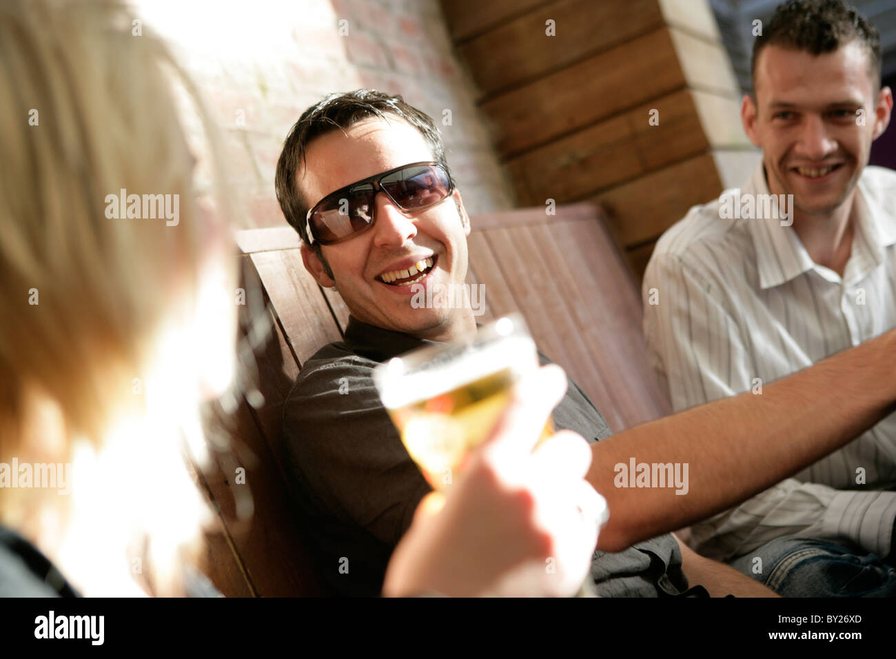 Friends drinking at a bar Stock Photo - Alamy