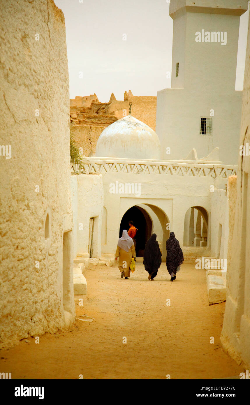 Tripoli, Libya; Veiled woman walking through the streets of the old ...