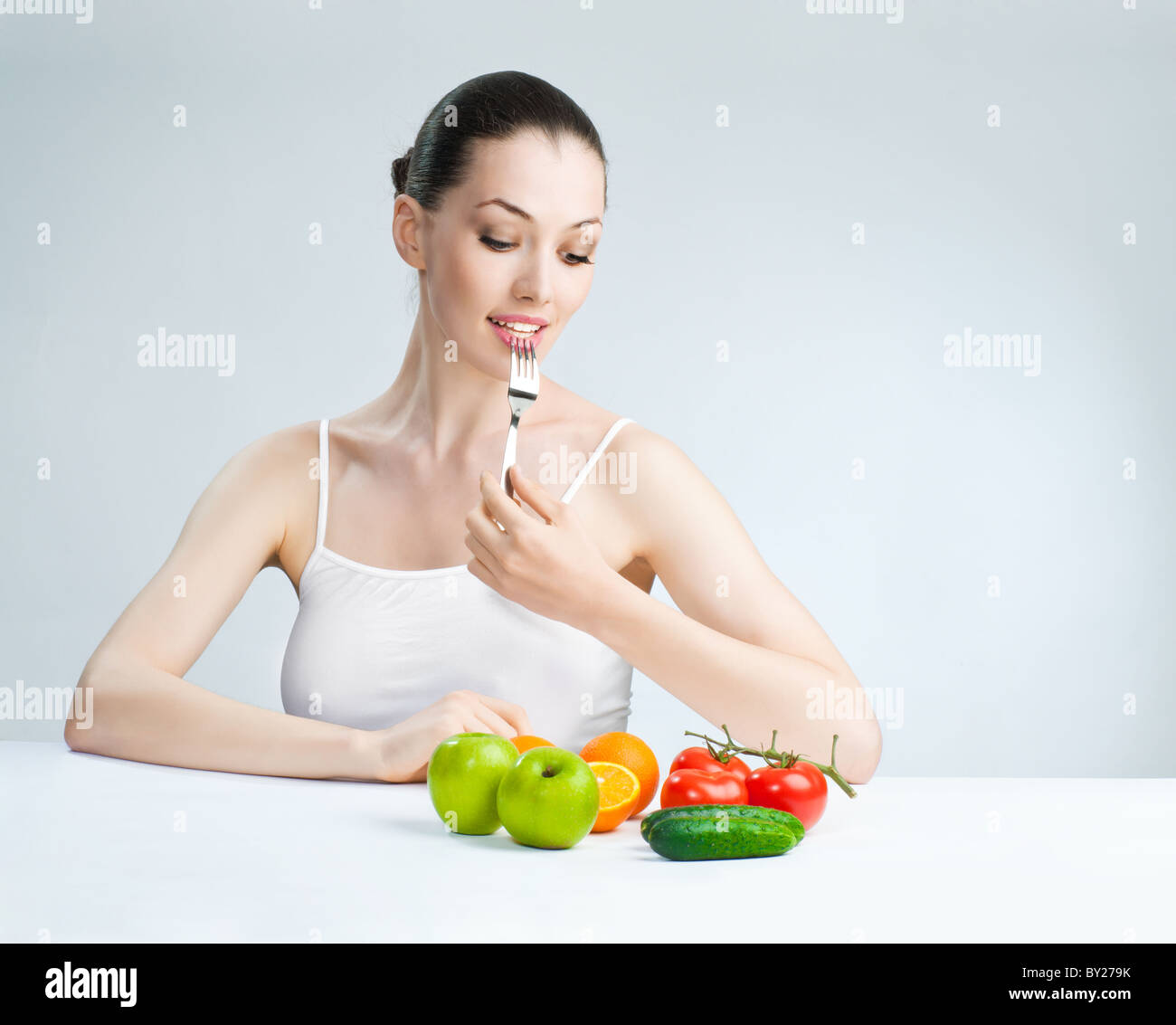 A beautiful slender girl eating healthy food Stock Photo - Alamy
