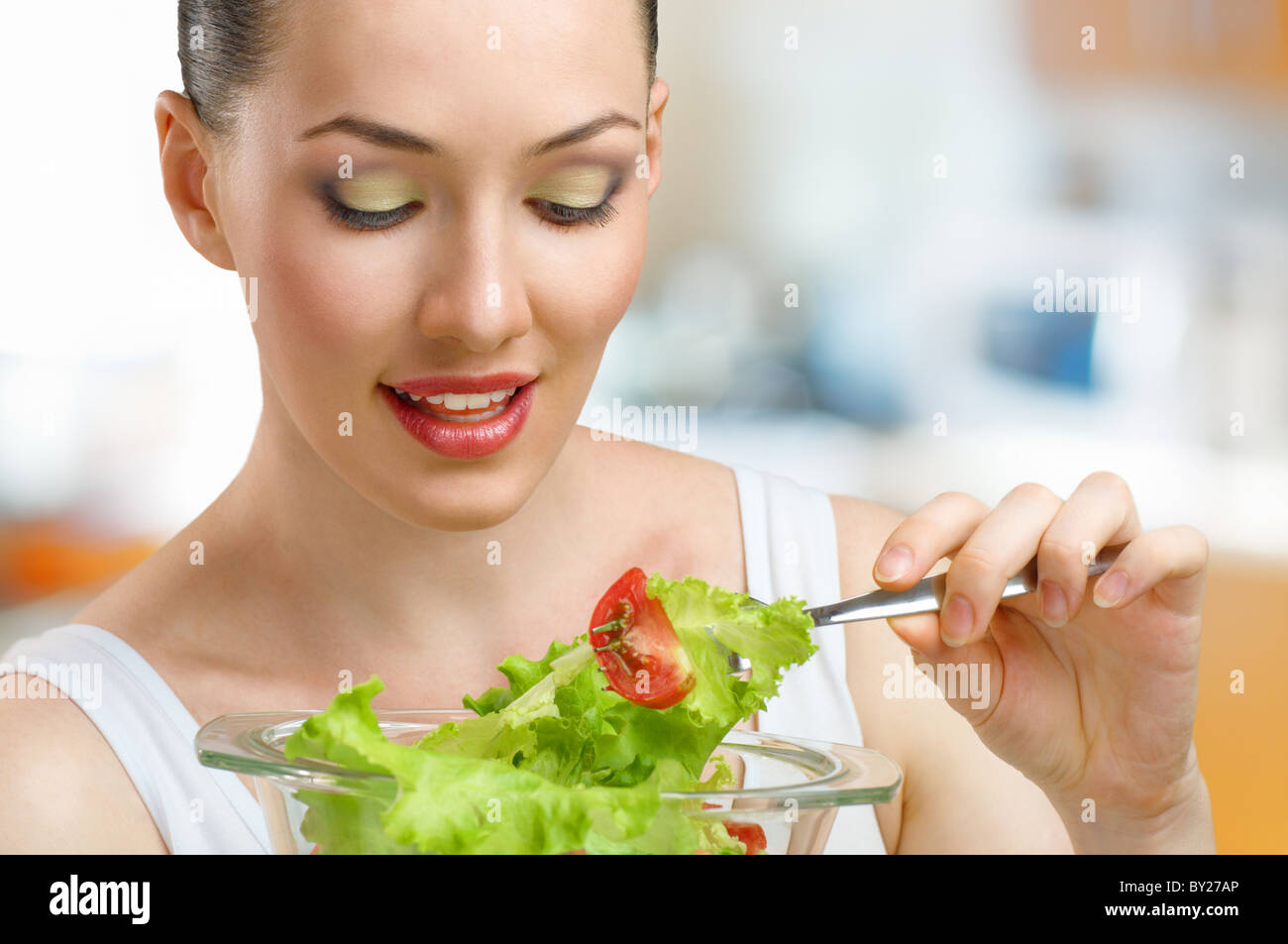 A beautiful slender girl eating healthy food Stock Photo - Alamy