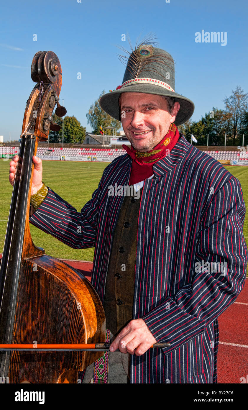 Great music traditional dress older man portrait in costume with bass ...
