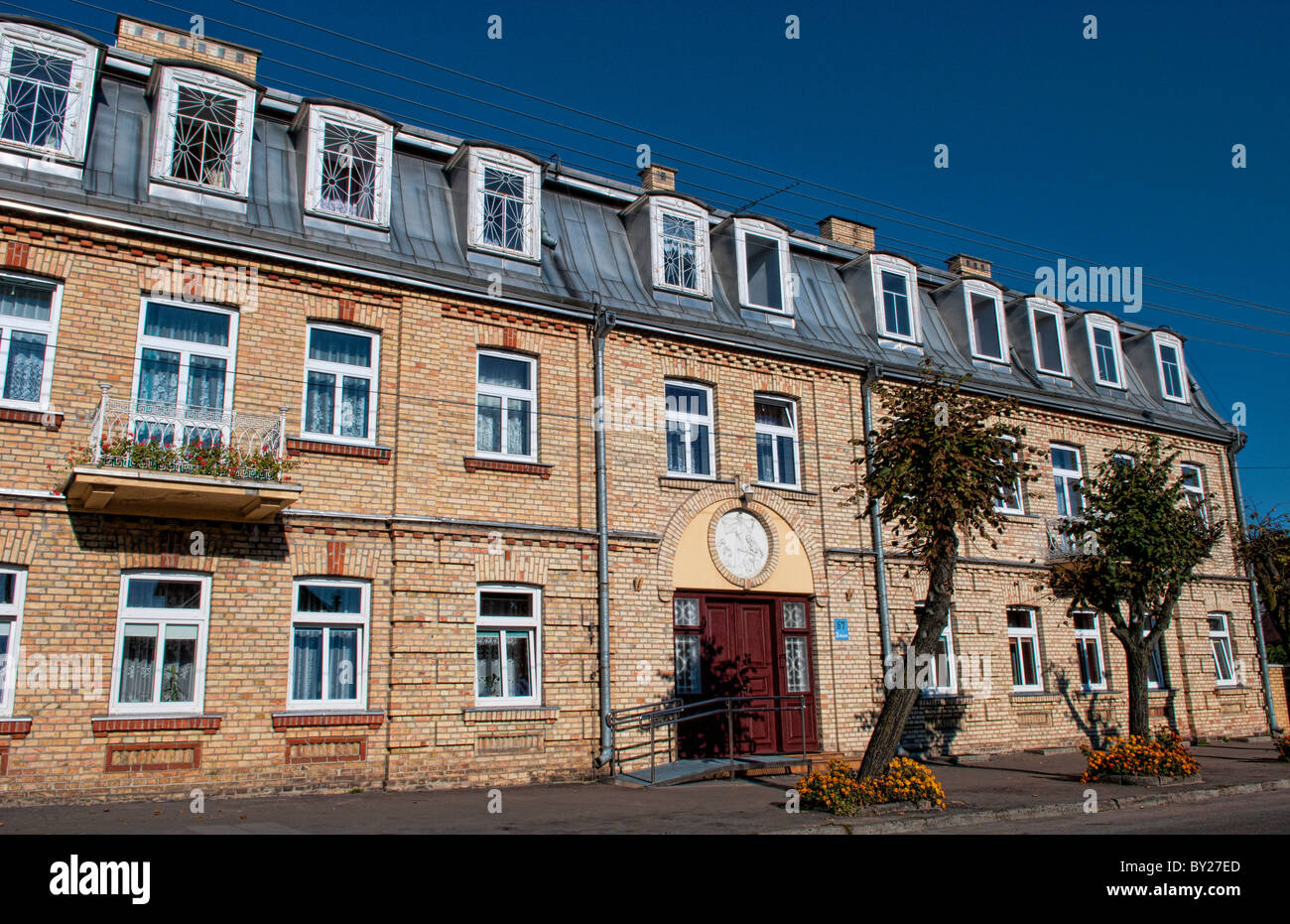 Beautiful business building with flowers in village of Augustow Poland ...