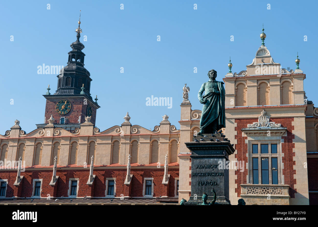 Old bronze statue in center of Main Market Square beautiful Krakow ...