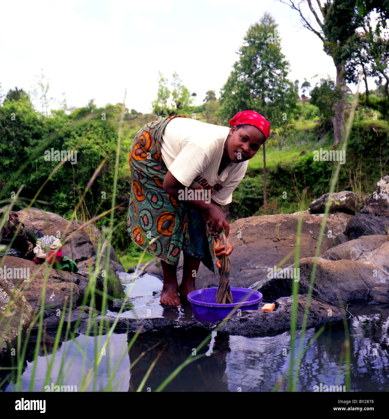 A woman doing her washing on Sunday. Tanzania Stock Photo - Alamy