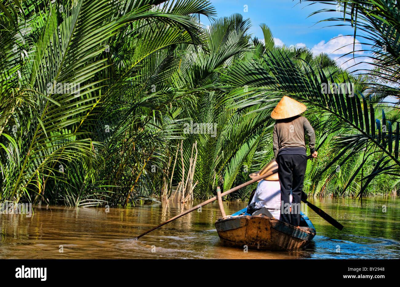 Mekong Delta water river swamps of green muddy water woman in straw hat ...