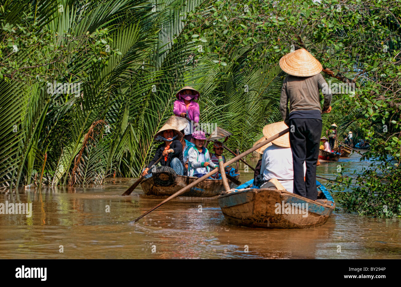 Mekong Delta water river swamps of green muddy water woman in straw hat ...