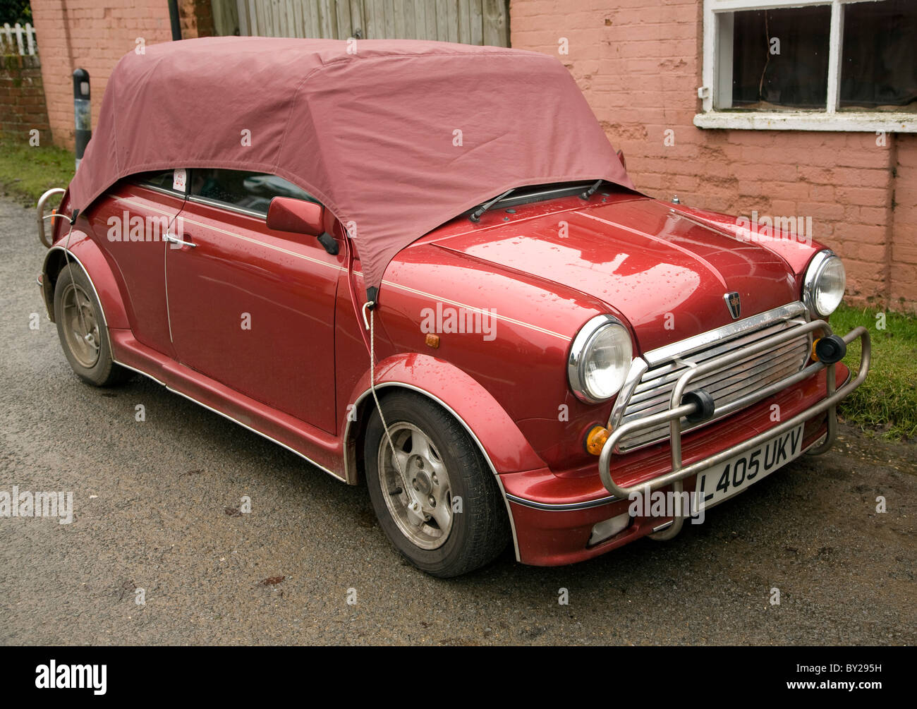 Red mini Cabriolet open top car with cover Stock Photo - Alamy