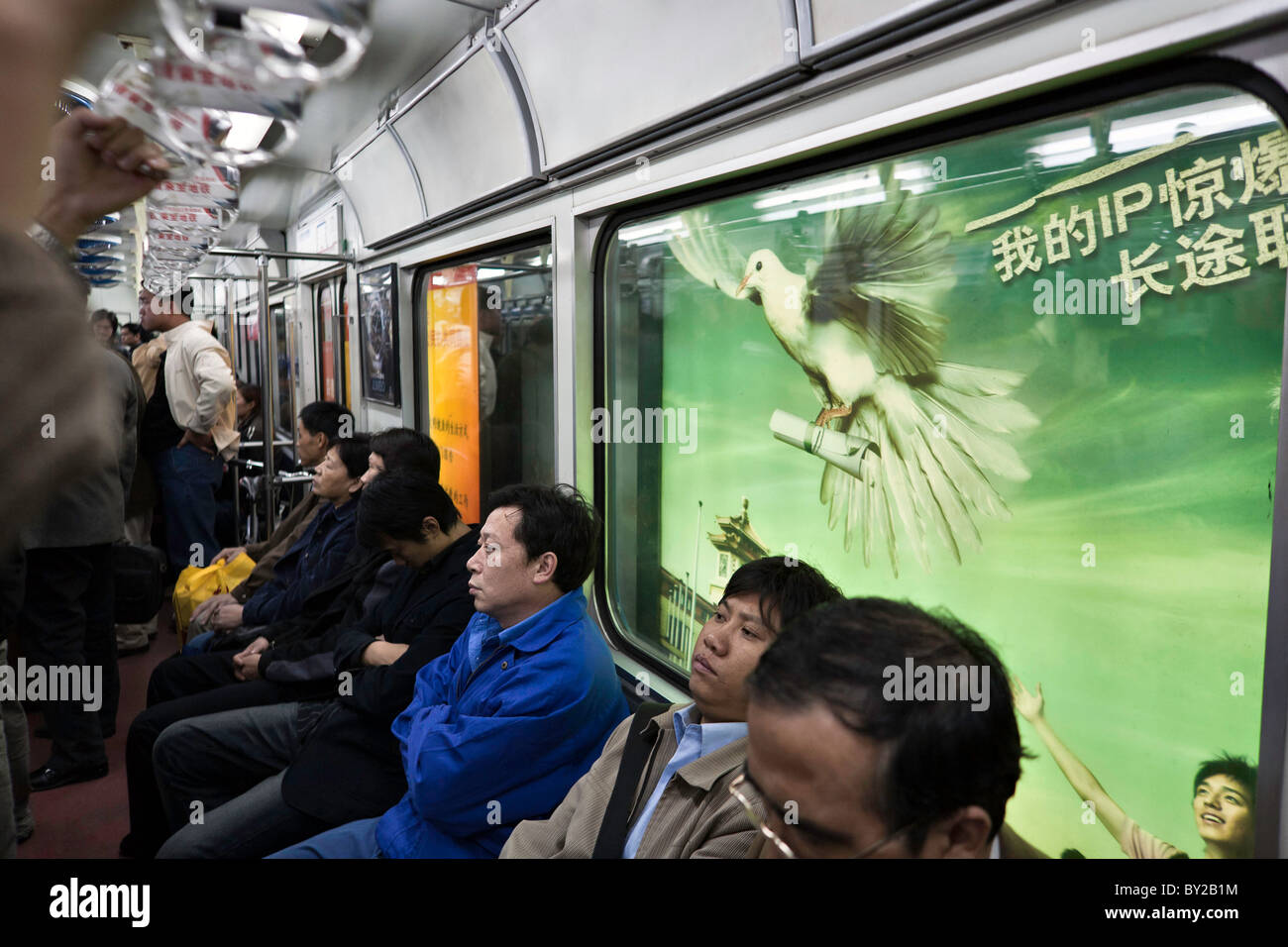CHINA, BEIJING: Chinese men riding the Beijing subway, the rapid ...