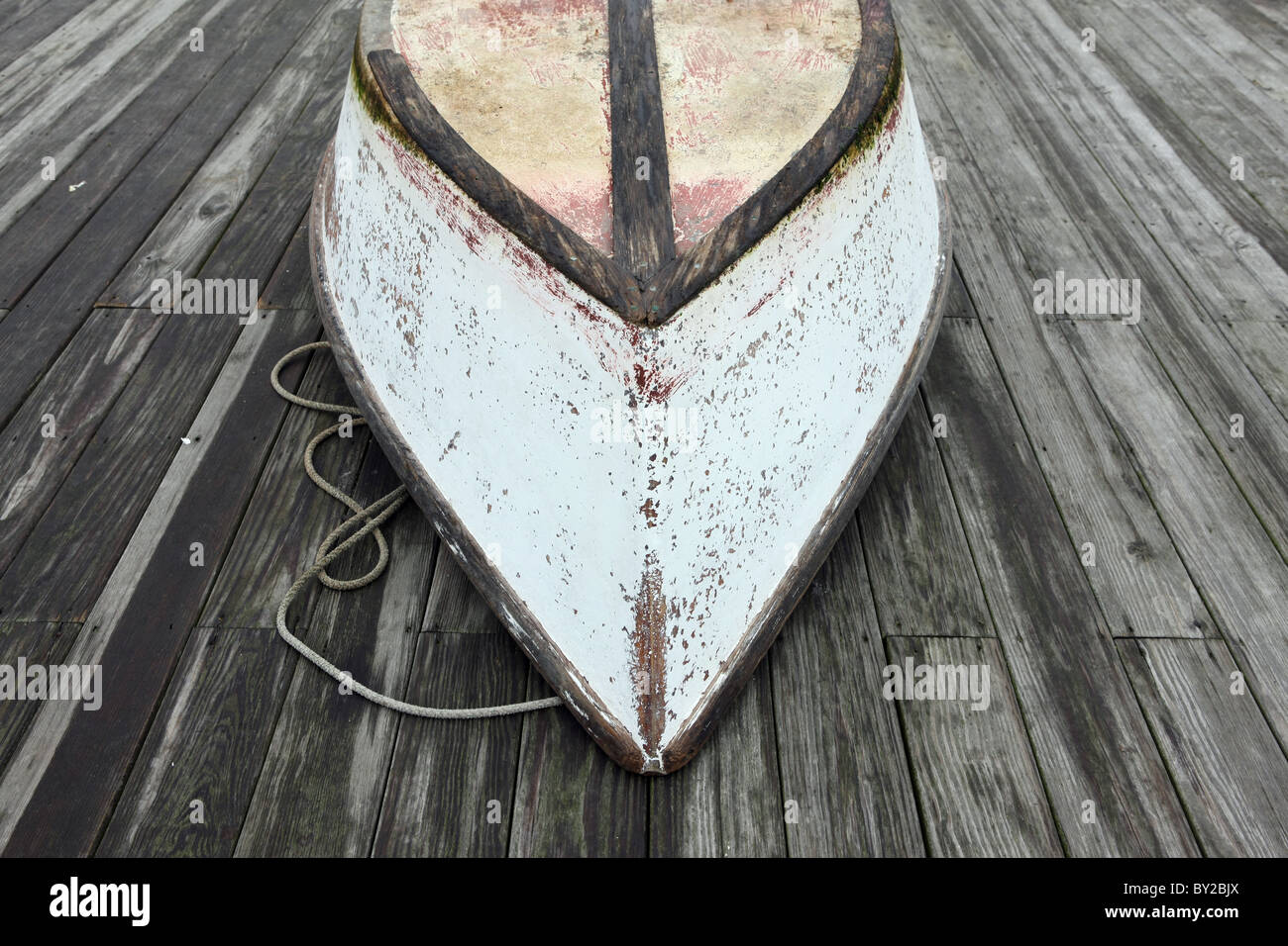 A row boat sits over turned on a dock to dry out in Acadia, Maine Stock ...