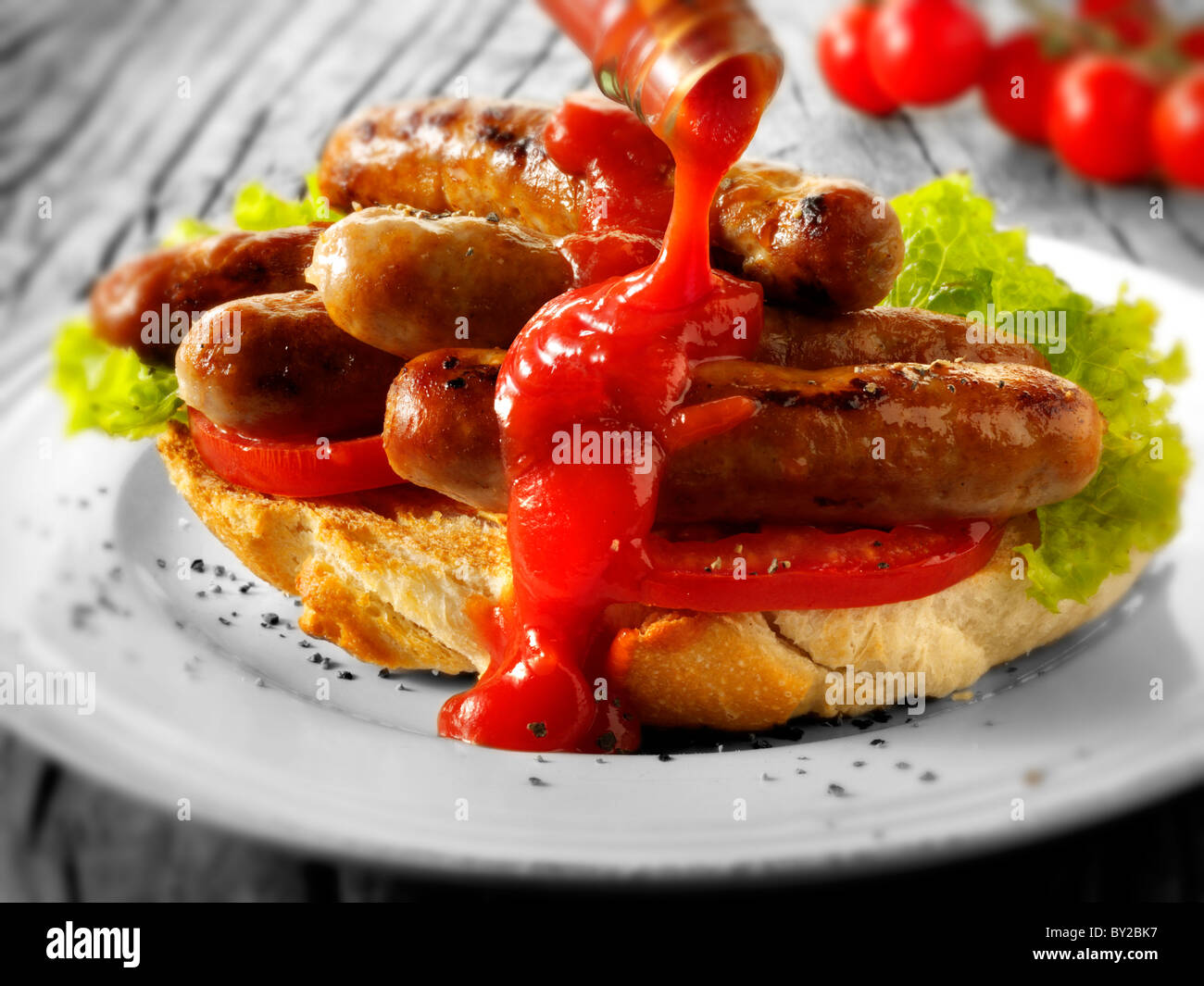 Traditional chipolatta pork sausages with tomato ketchup sandwich Stock ...