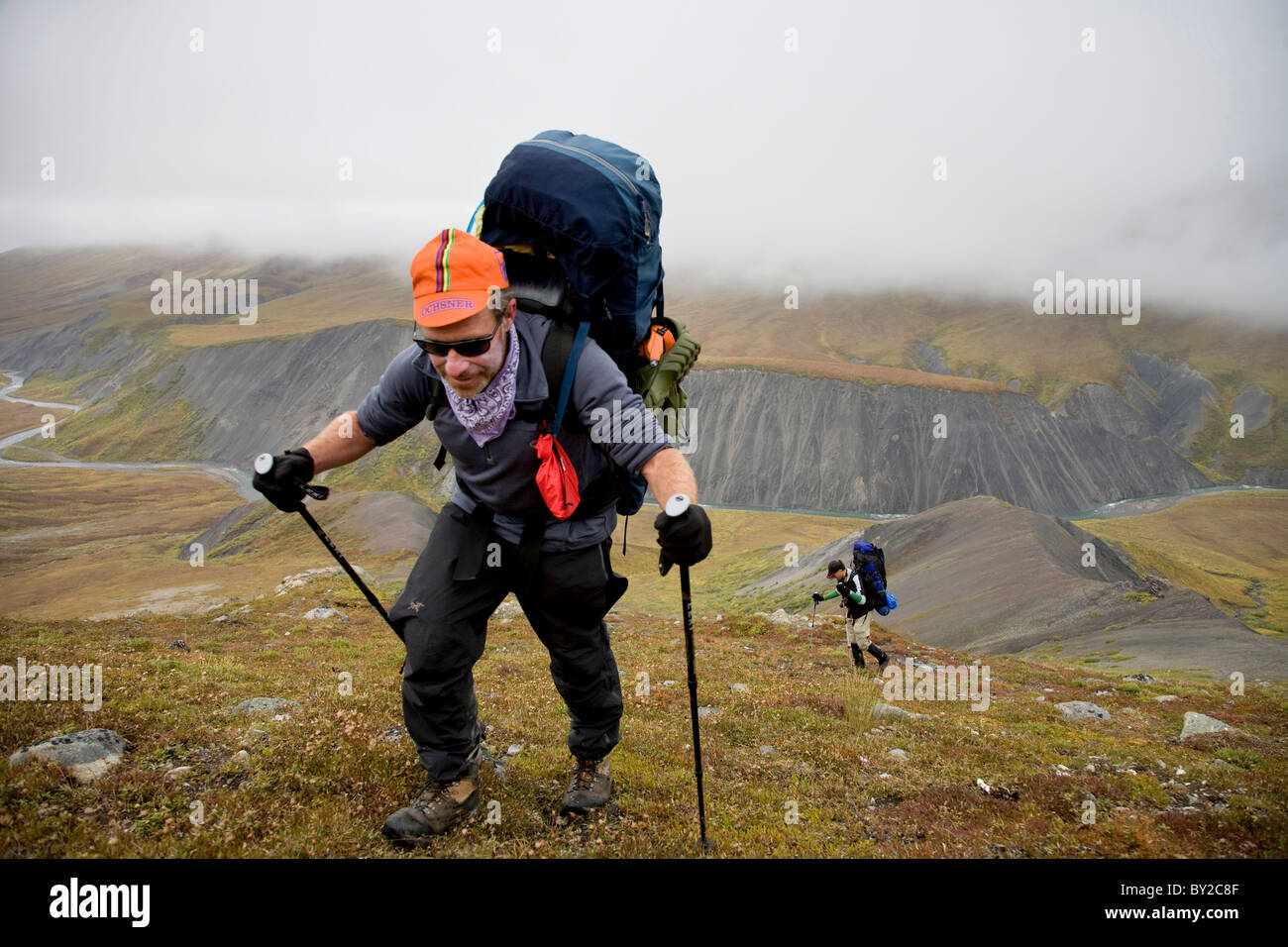 A backpacker hikes alon gthe Atigun River in Alaska's Arctic National ...