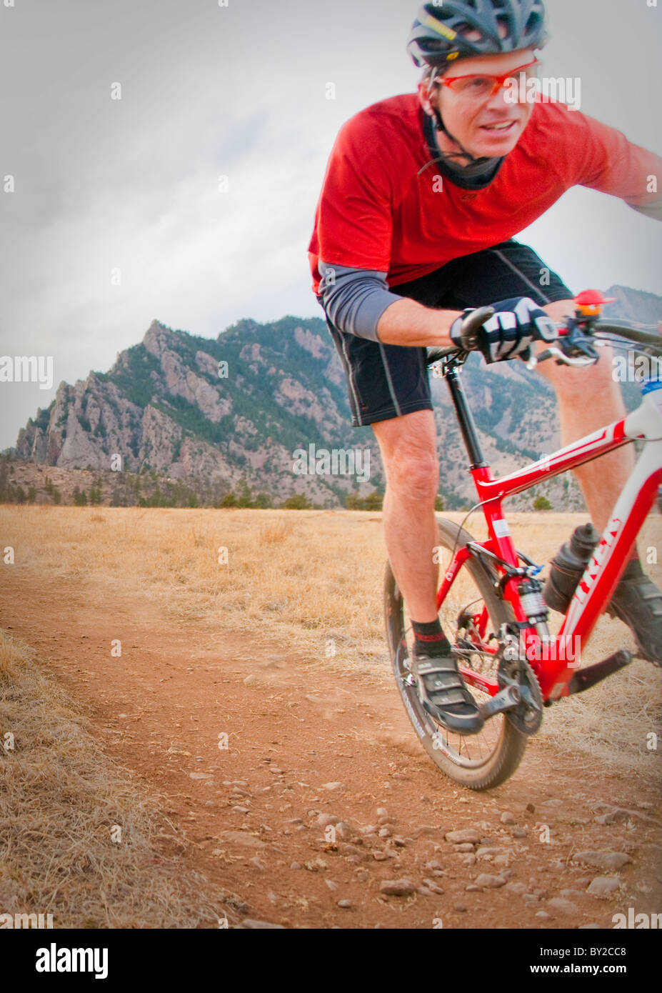 A man enjoys a mountain bike ride on the Springbook trail, which is ...