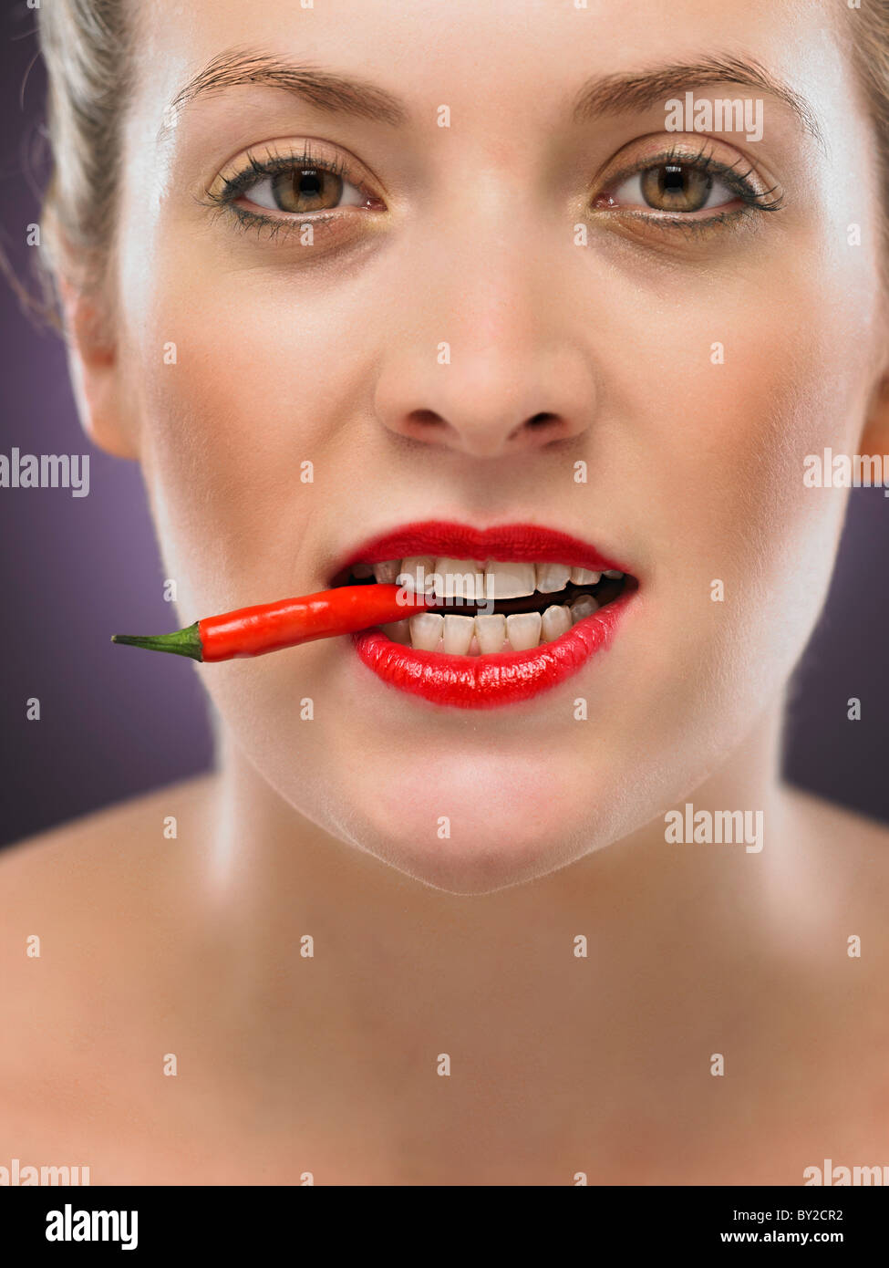 Biting a chili hi-res stock photography and images - Alamy