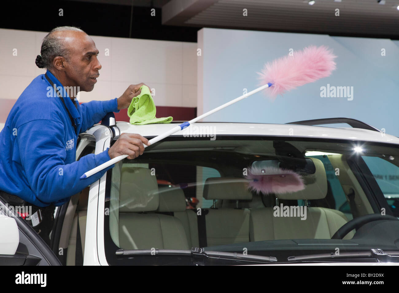 Detroit, Michigan - A worker cleans a car at the North American ...