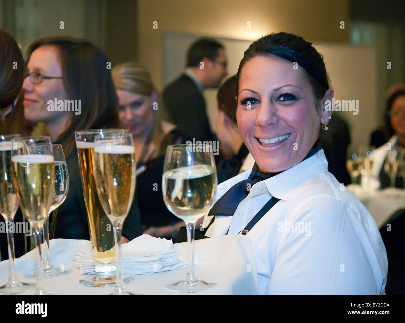 Worker Serves Alcoholic Drinks at Party Stock Photo - Alamy