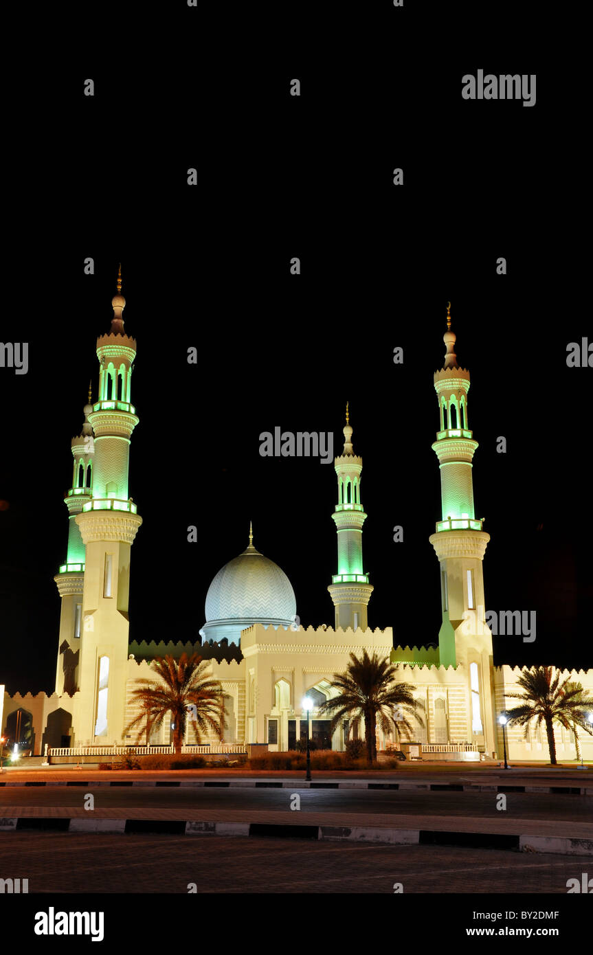 A beautiful mosque with four minarets in the night in Ajman, UAE Stock ...