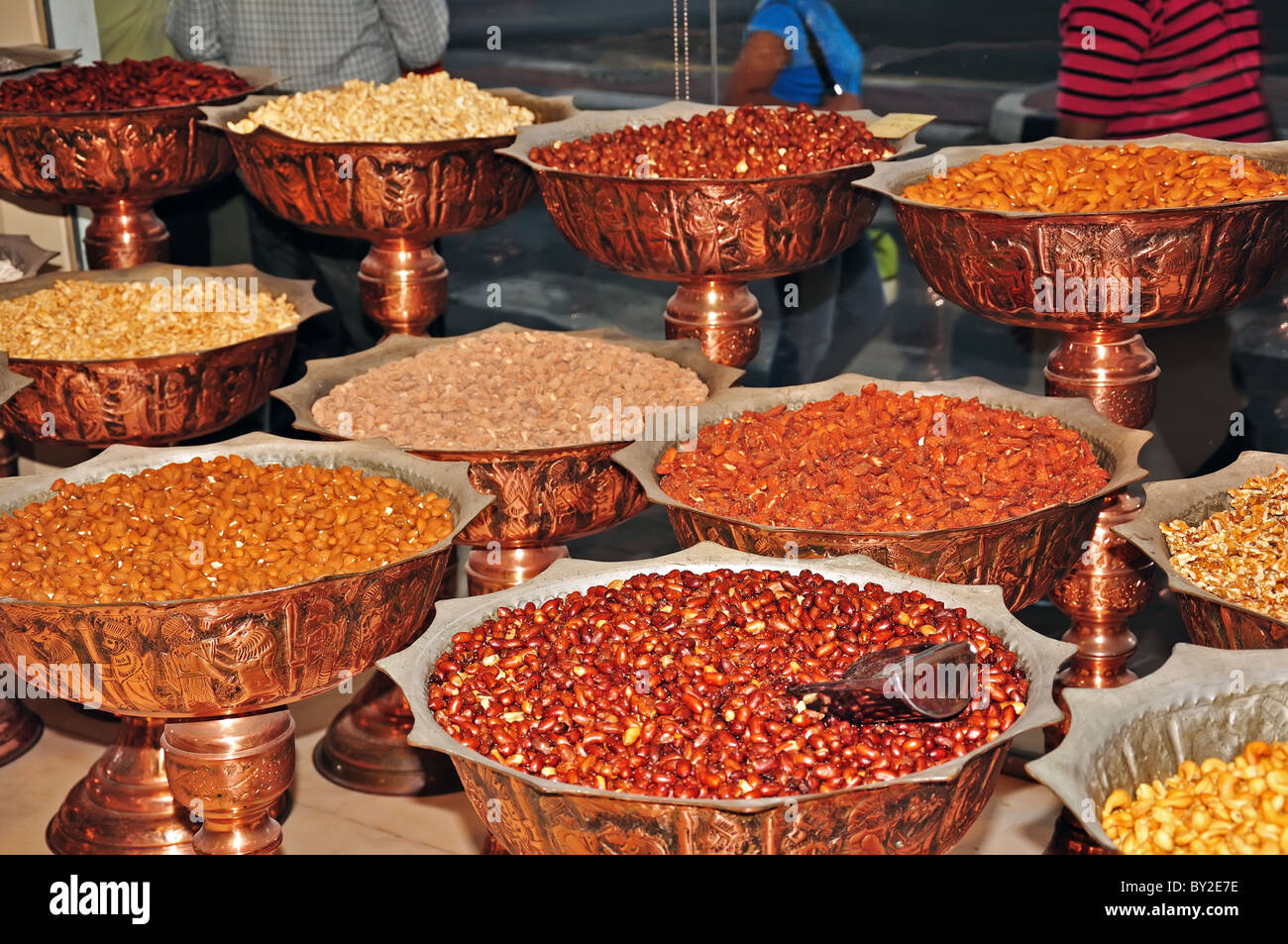 Metal bowls of nuts in the sweets market Stock Photo - Alamy