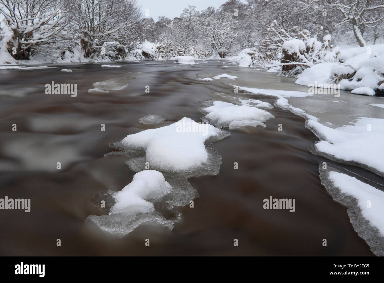 Looking down a freezing river Stock Photo - Alamy