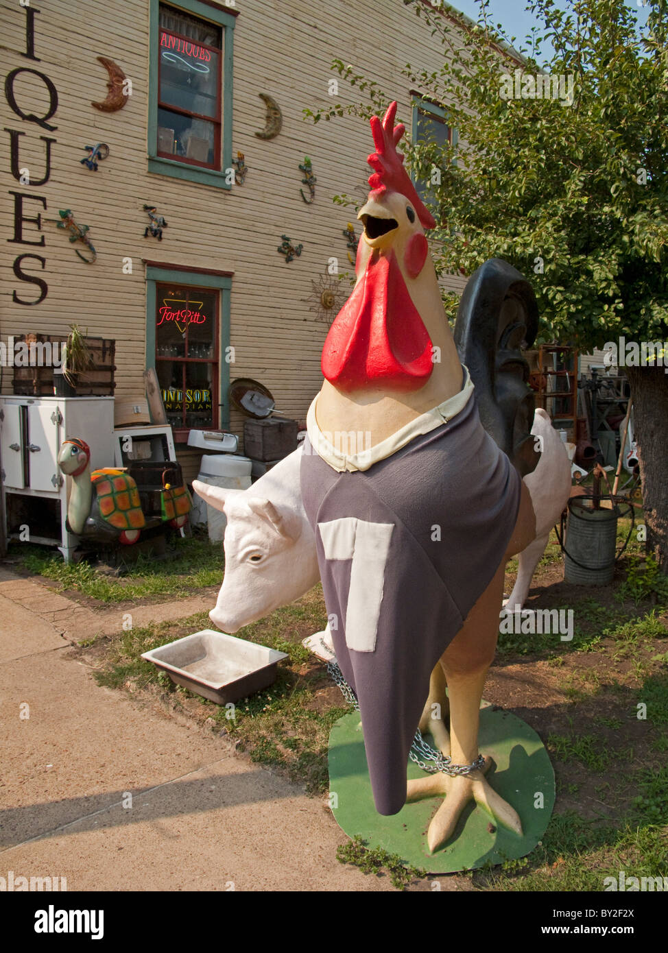 Antique rooster & pig sculpture Stock Photo - Alamy