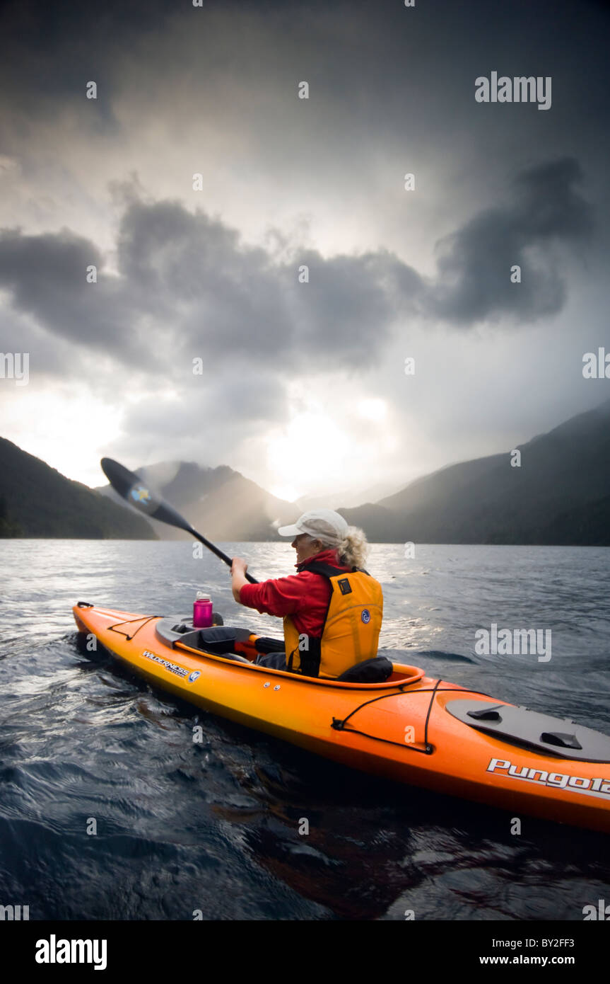 Middle aged woman kayaking on Lake Crescent, Olympic National Park, WA, USA Stock Photo - Alamy