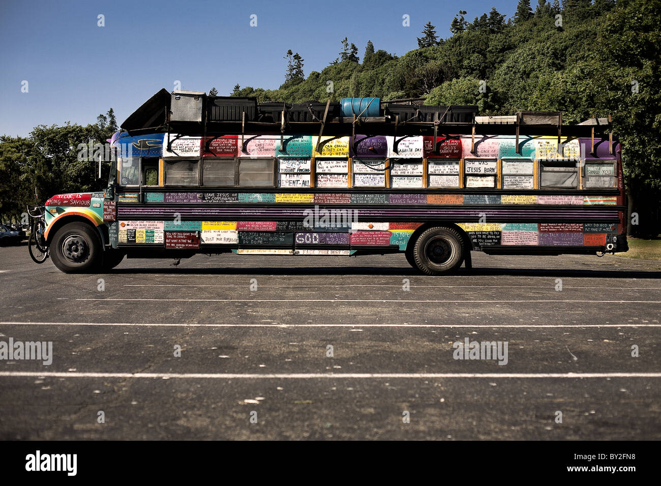 A brightly painted bus covered in various extreme Christian messages ...