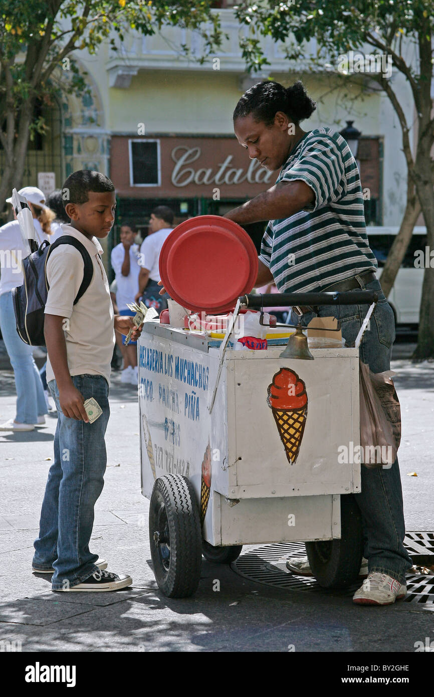 Small boy purchasing a ice cream cone from a street vendor in Old Town ...