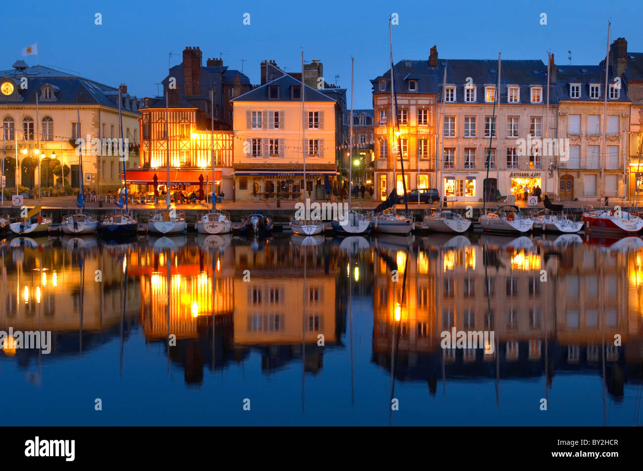 night harbour scene with lights of yaughts and harbour restaurants ...