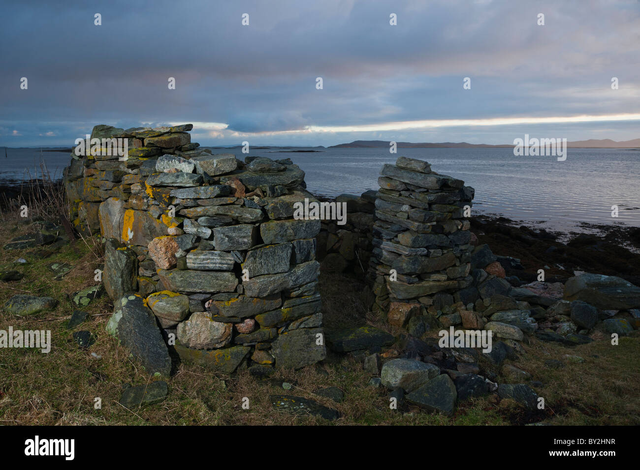 Ruins of Dereclict croft house near sea, Berneray, Western Isles ...