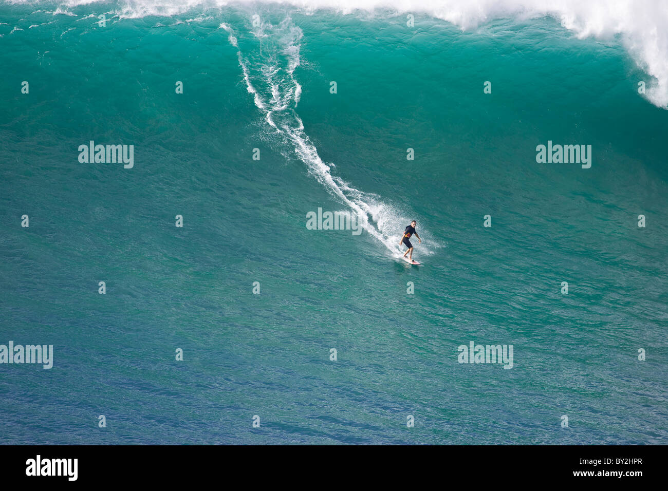Ariel view of a young man tow Surfing at Phantoms on the north shore of ...