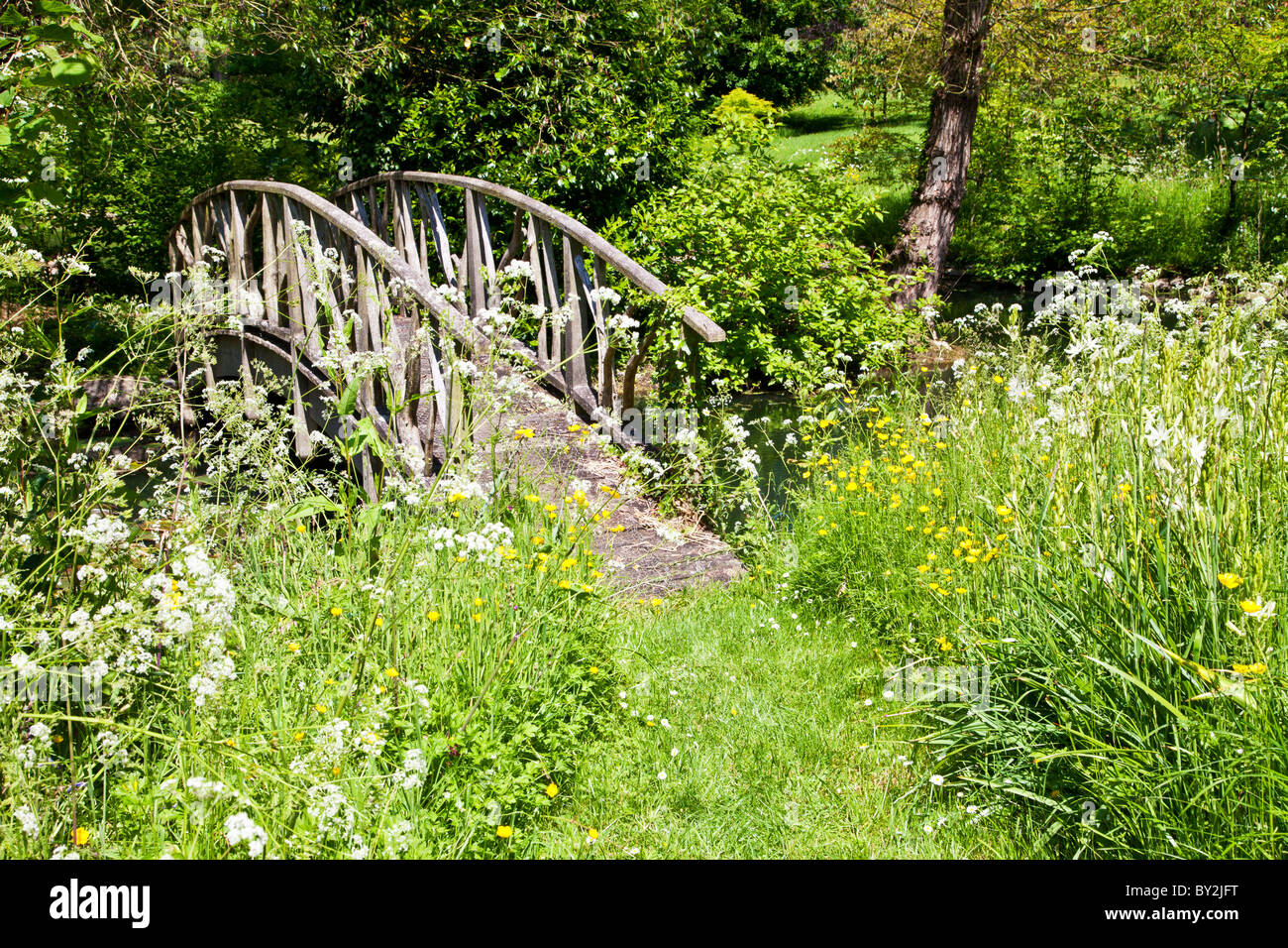 A charming rustic footbridge in a quiet corner of an English country ...