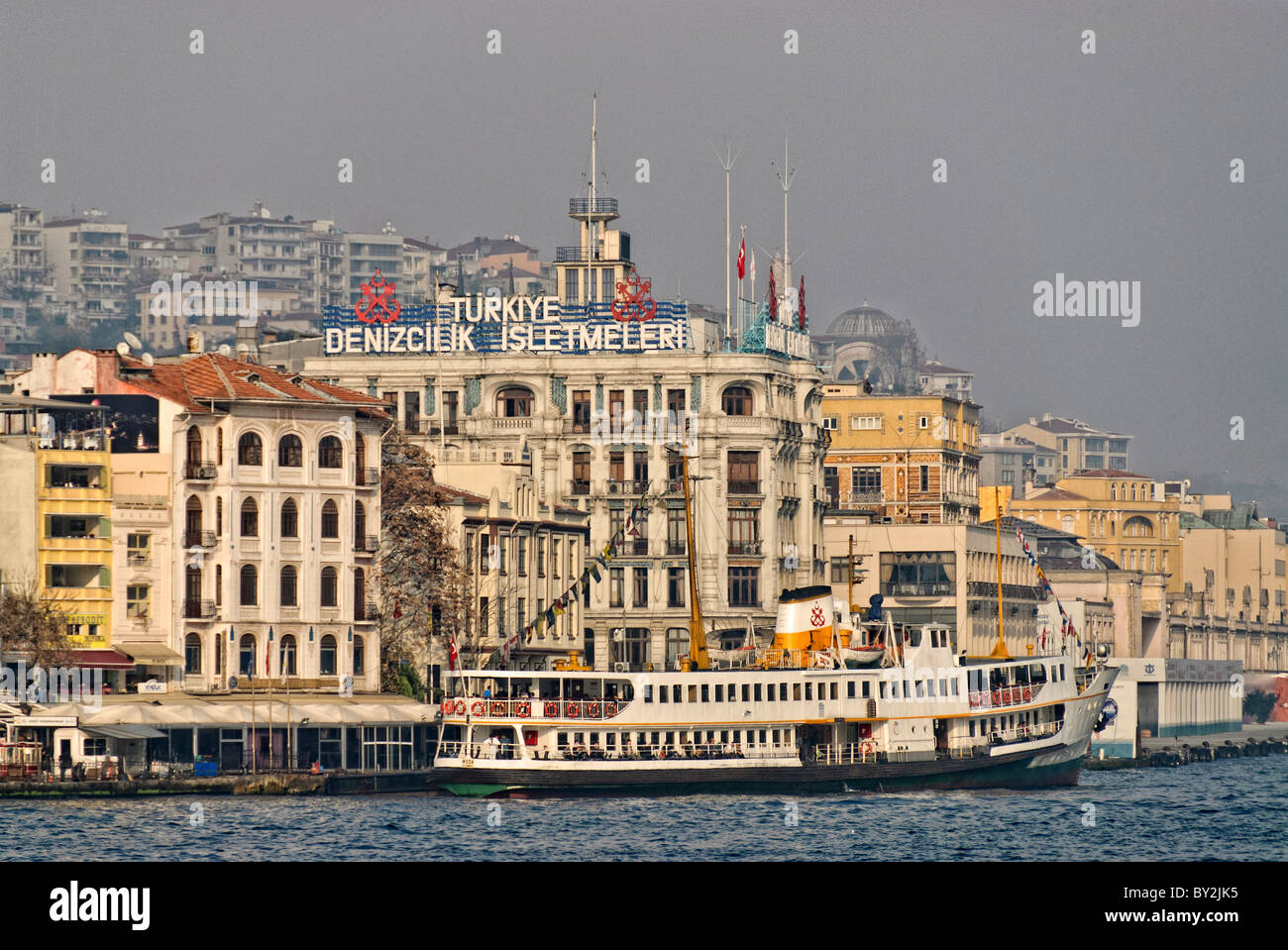 ISTANBUL, Turkey — A ferry docked in front of the old waterfront of ...