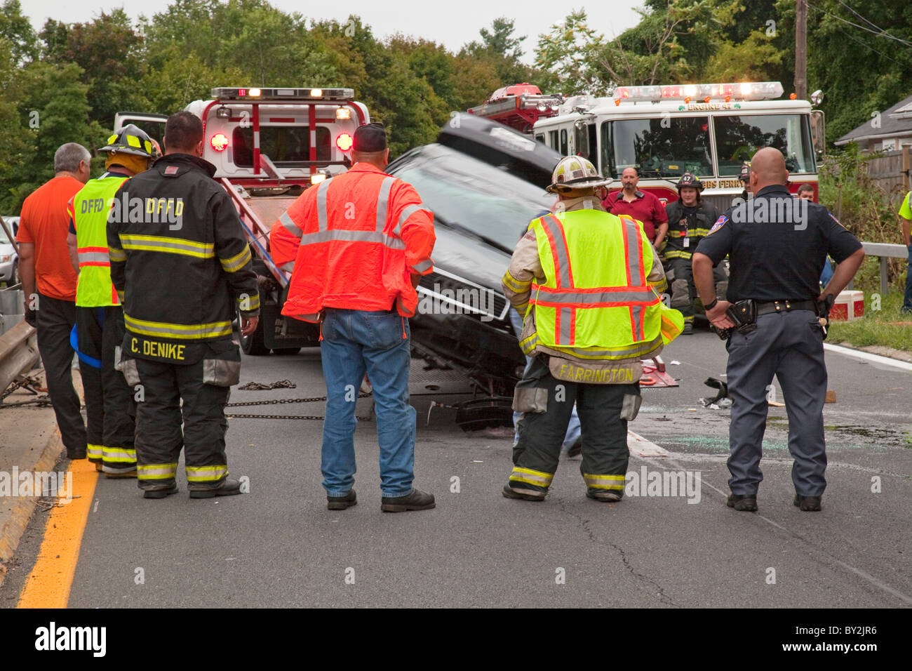 Car flipped over in road Stock Photo - Alamy