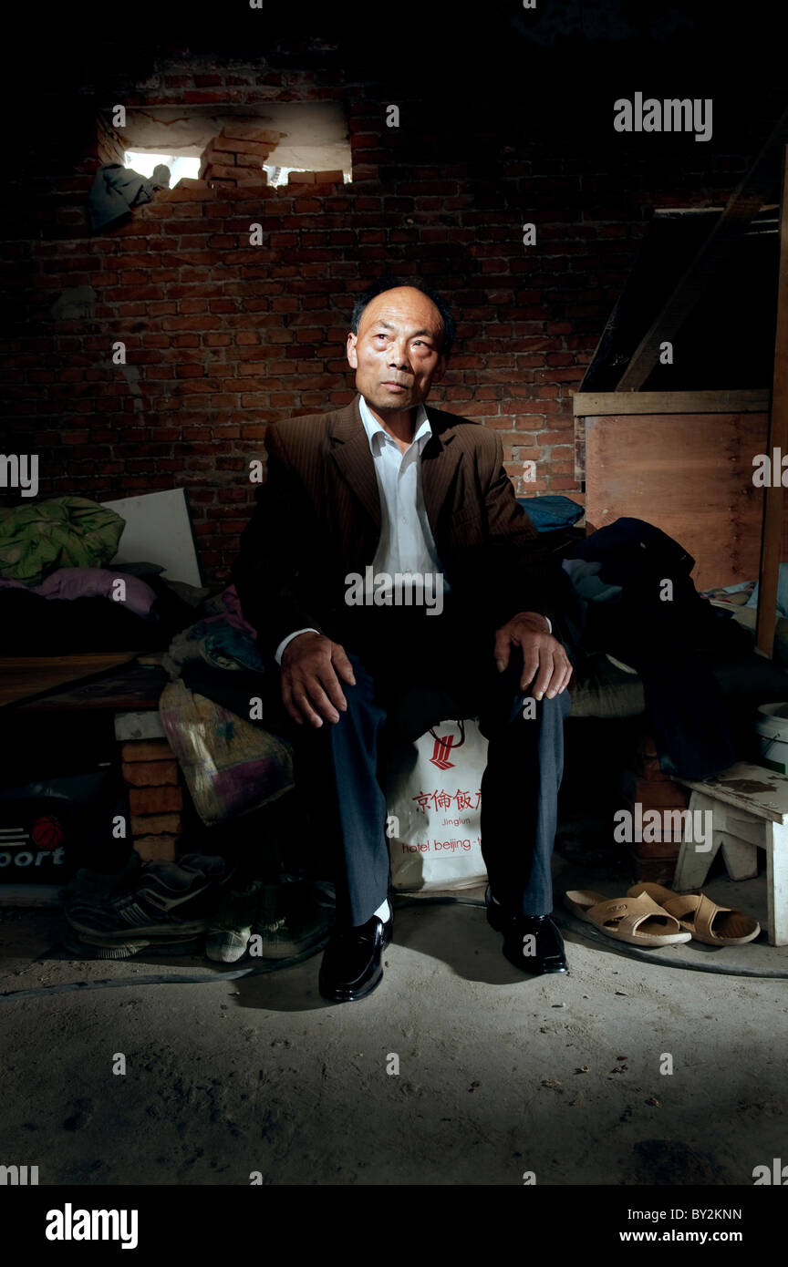 A chinese construction worker in his room Stock Photo - Alamy