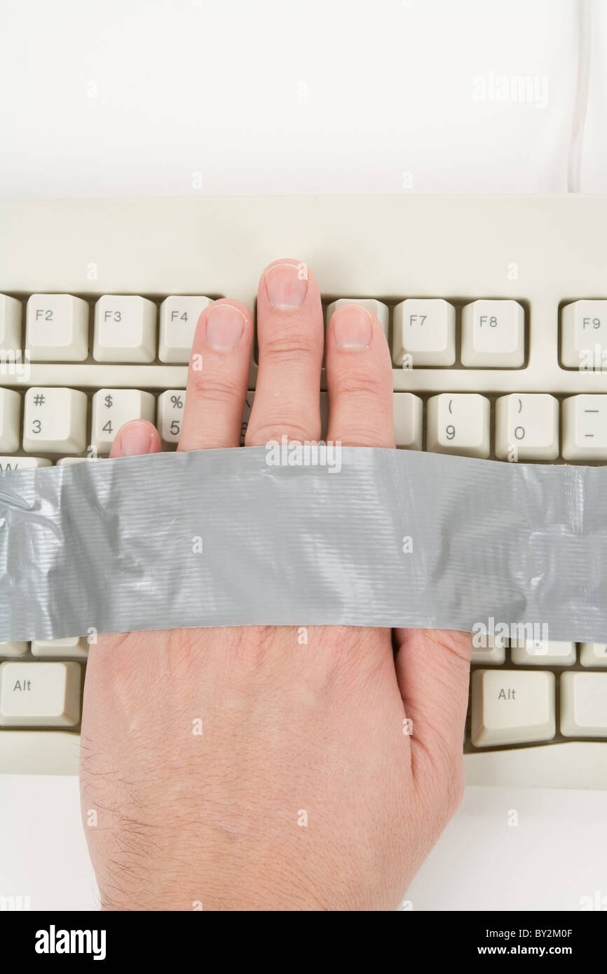 Hand had been stuck on Computer Keyboard Stock Photo - Alamy